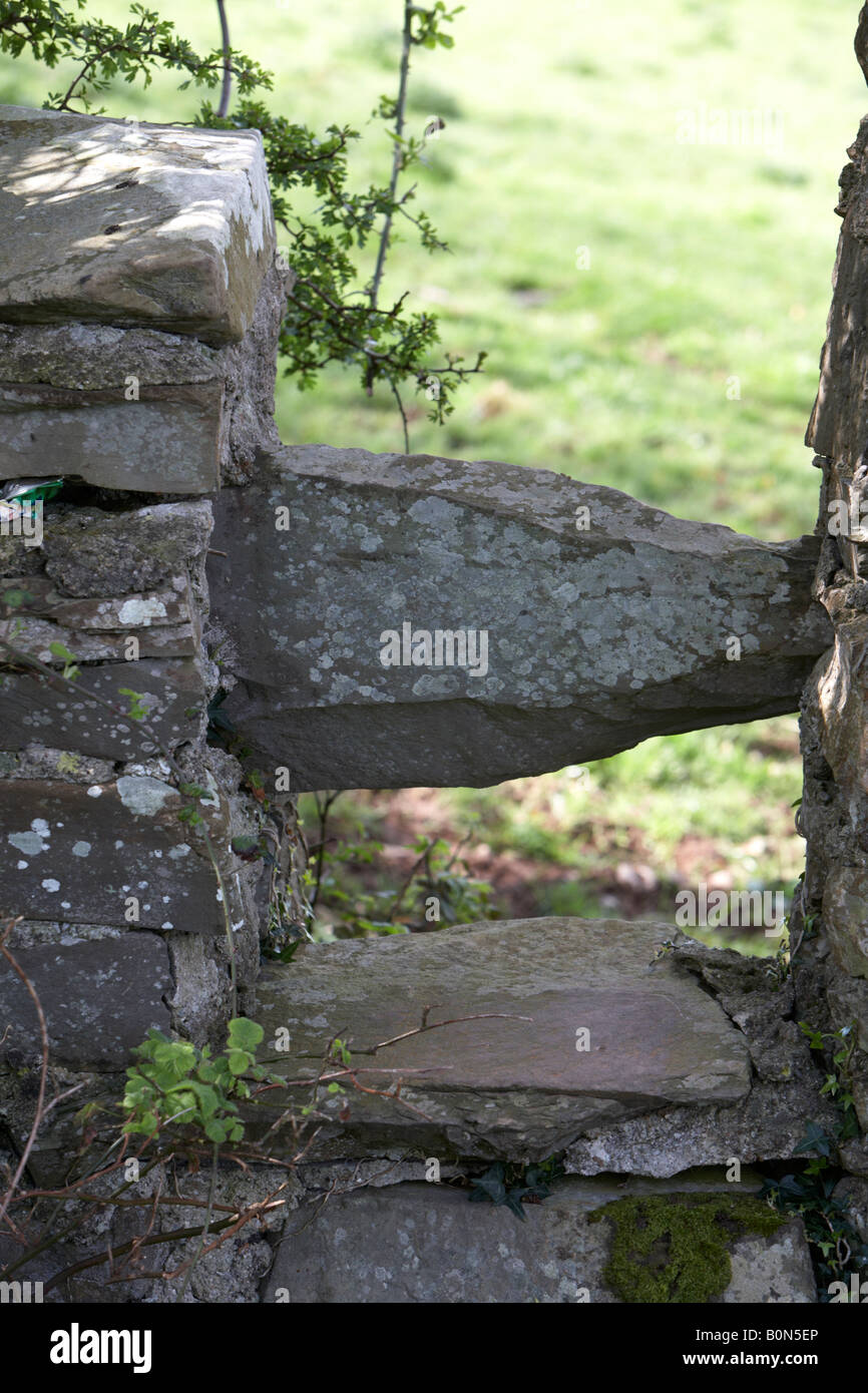 stone stile gap in a stone wall entrance to a field Stock Photo - Alamy
