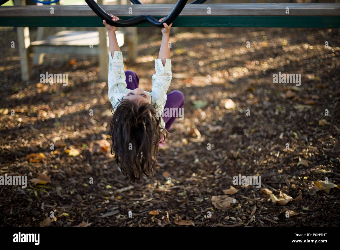 Child hanging upside down on climbing hi-res stock photography and ...
