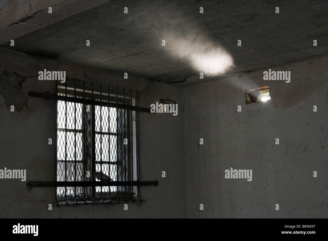 Interior shot of gloomy old prison cell Stock Photo - Alamy
