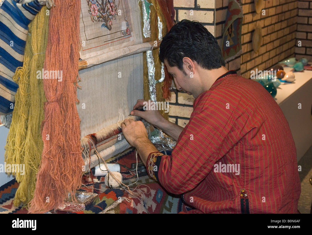 Young man weaving traditional loom hi-res stock photography and images ...