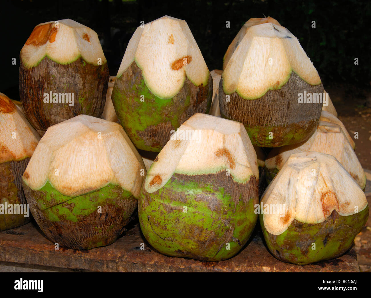 Chilled coconuts for sale at a market stall, Accra, Ghana Stock Photo ...