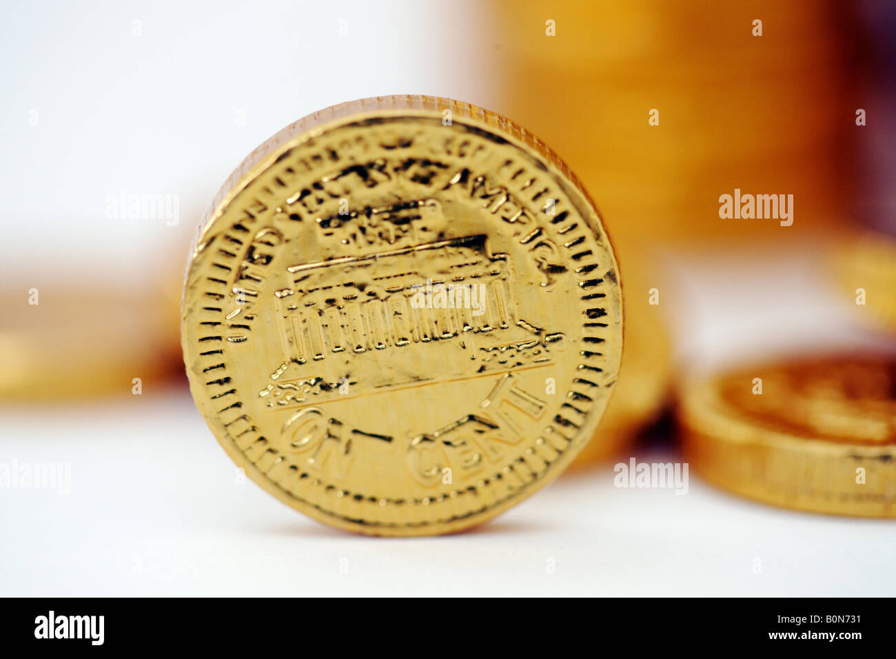 Stacked chocolate coins denoting several currencies Stock Photo - Alamy