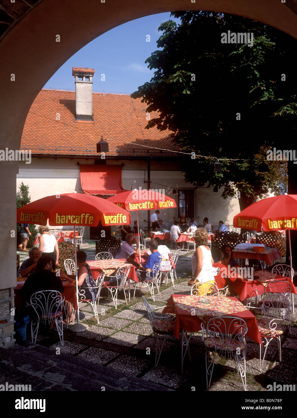 Slovenia - Open air cafe inside the walls of medieval castle on Lake ...