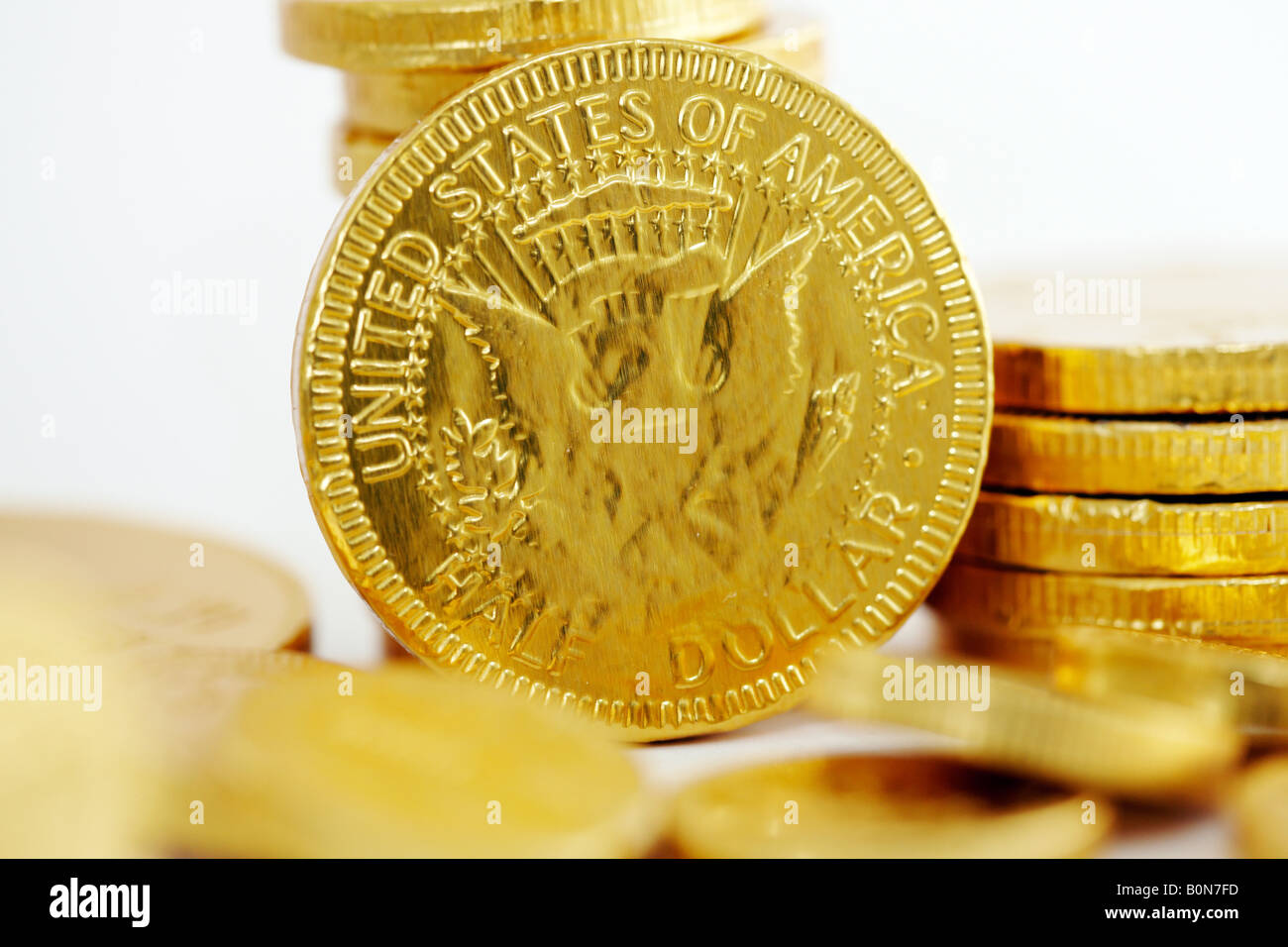 Stacked chocolate coins denoting several currencies Stock Photo - Alamy