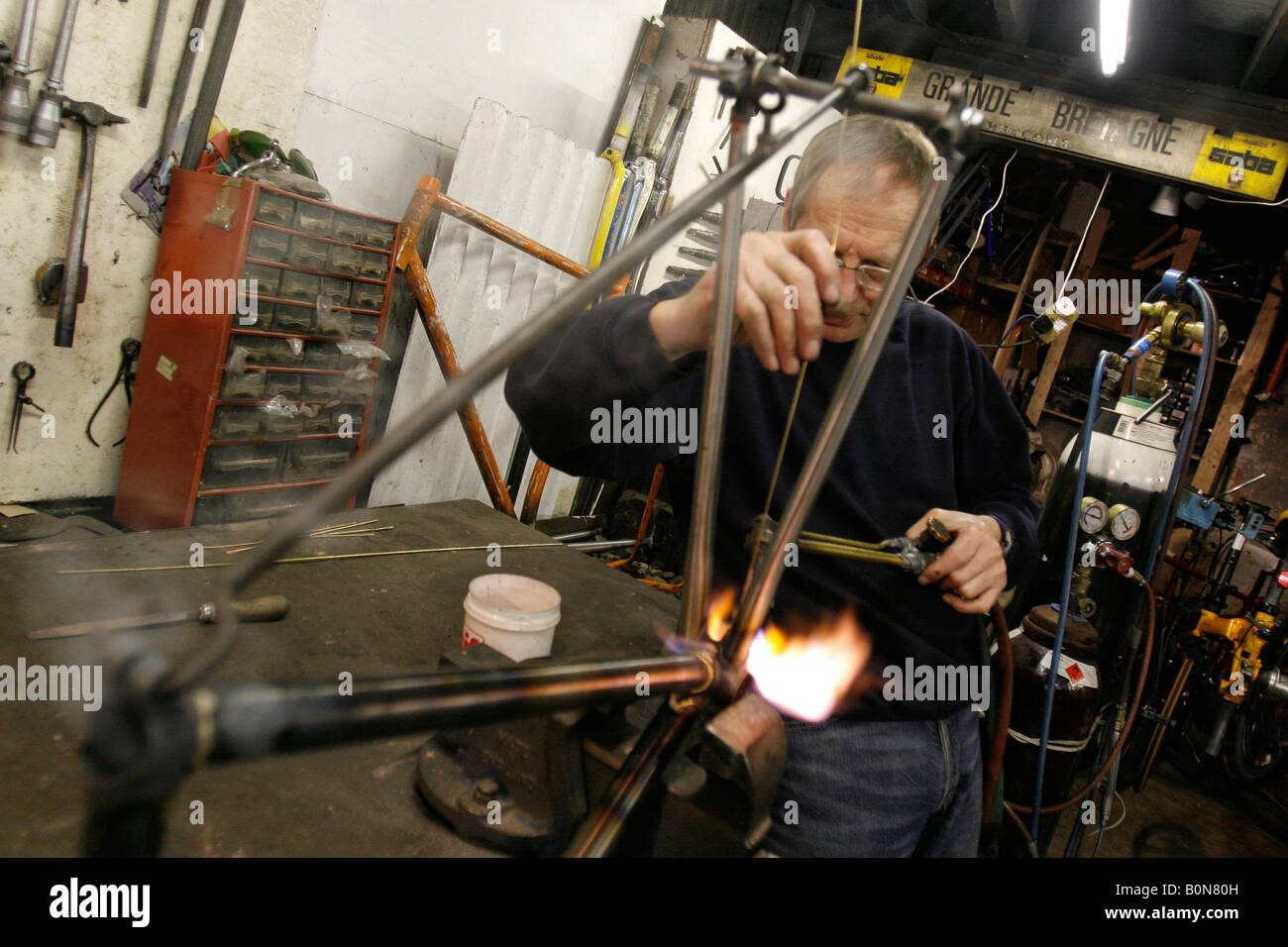 Welding together a bike frame Stock Photo - Alamy