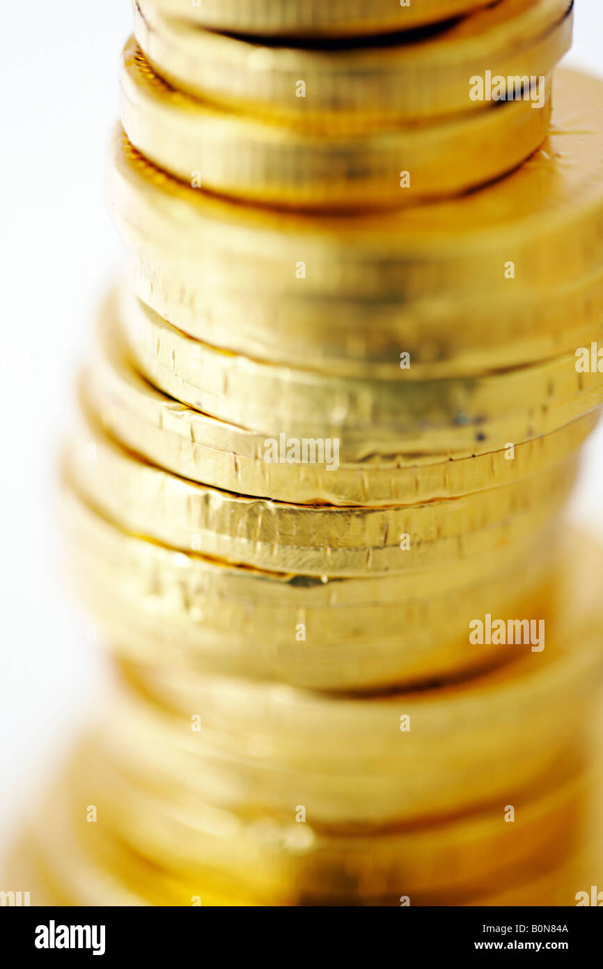 Stacked chocolate coins denoting several currencies Stock Photo - Alamy