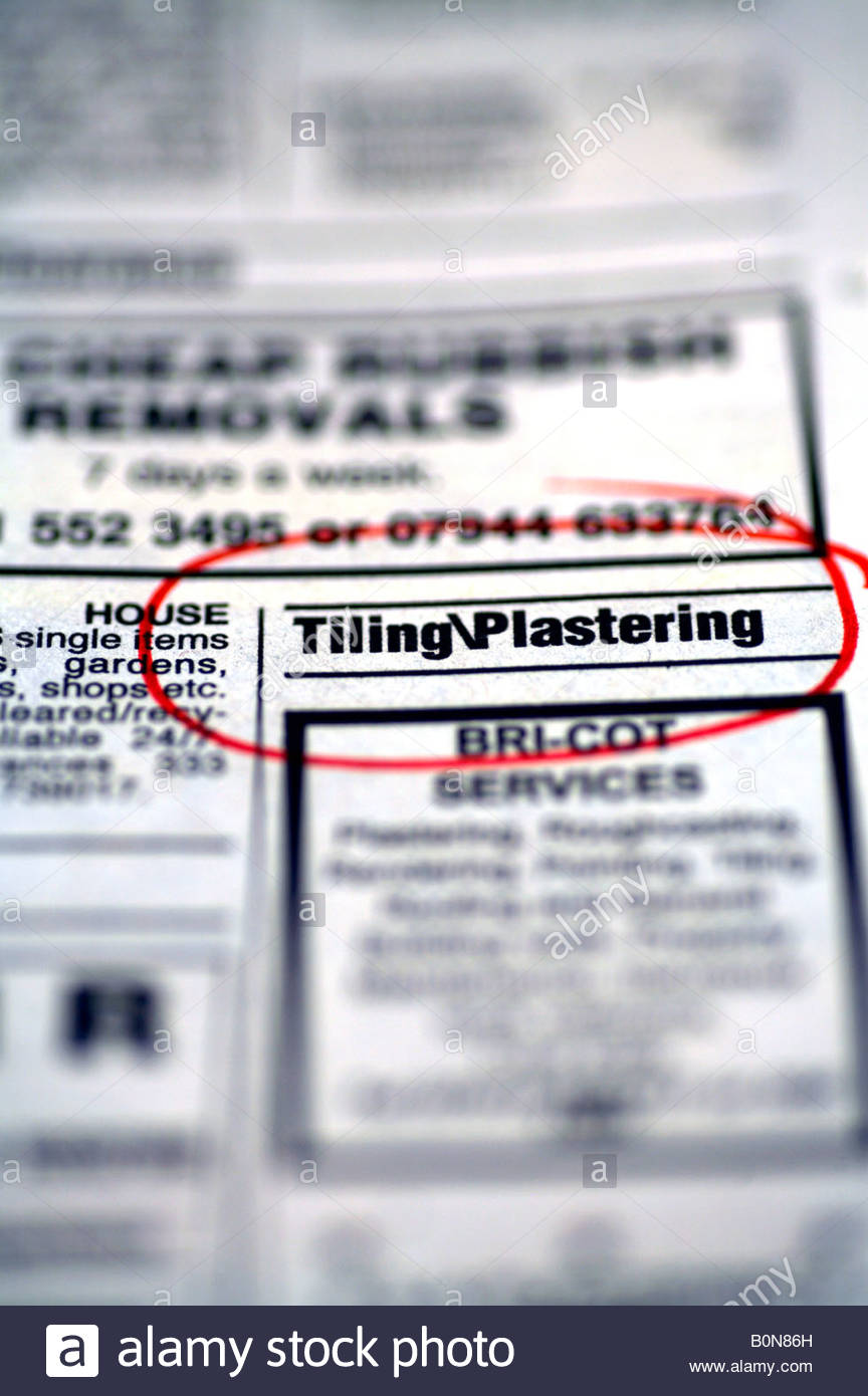 Tiling Plastering small ad in newspaper classifieds Stock Photo - Alamy