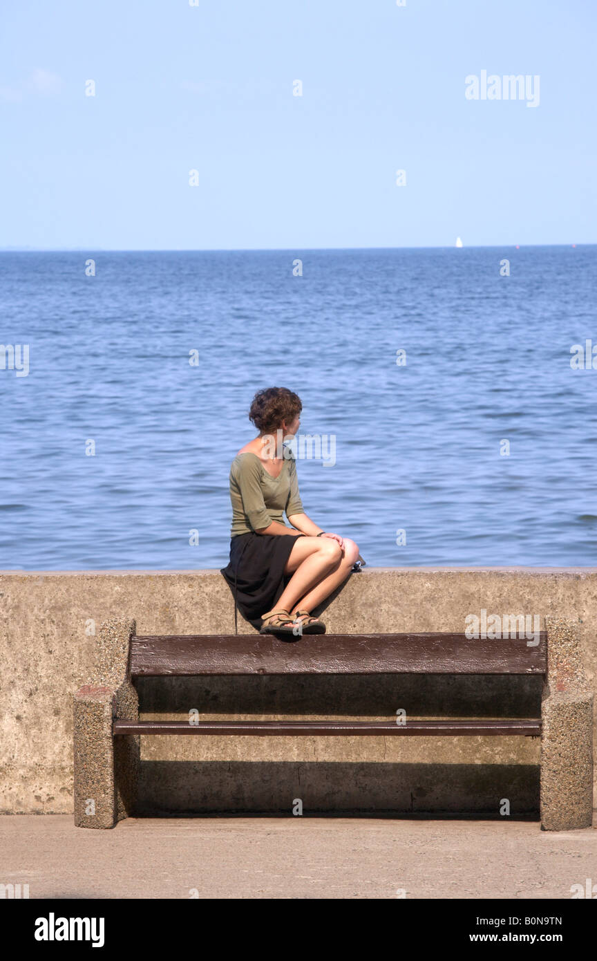 woman looking into the distance towards the horizon Stock Photo - Alamy