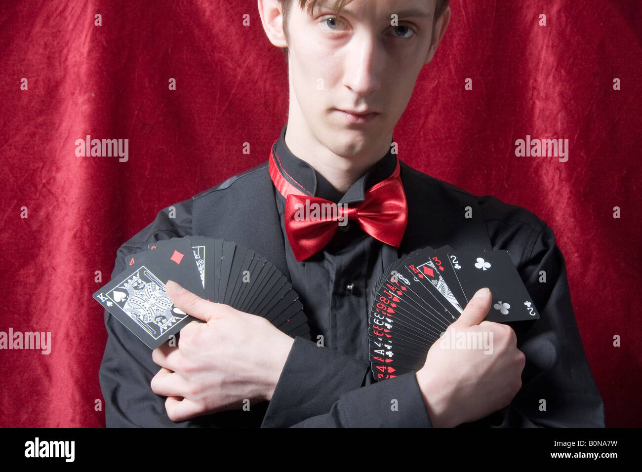 magician performing a card trick Stock Photo - Alamy