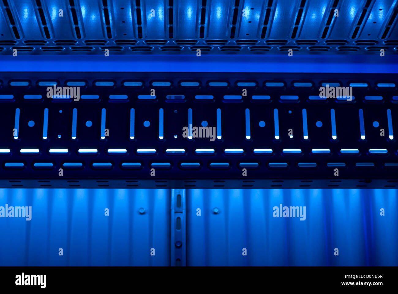 Blue light reflecting on metal to create a pattern Stock Photo - Alamy