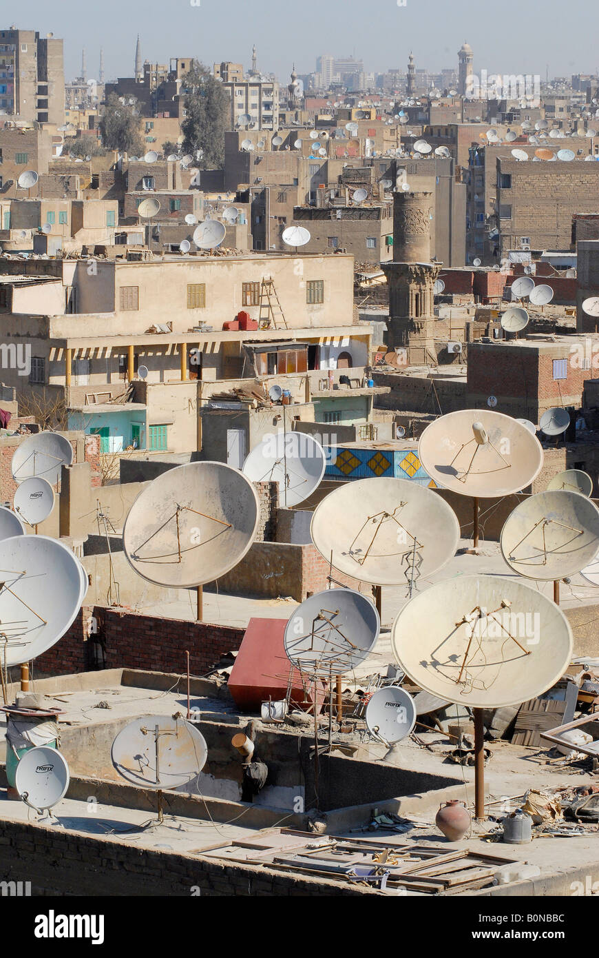 Satellite dishes over the roofs of Cairo. Satellite dishes are the ...