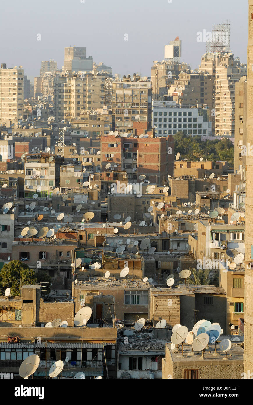 Satellite dishes over the roofs of Cairo. Satellite dishes are the ...