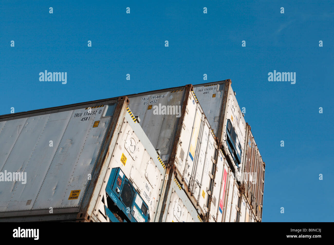 Shipping containers against blue sky Stock Photo - Alamy