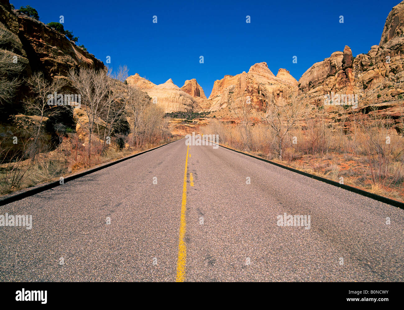 A view of sandstone cliffs and one of the long roads along the Fremont ...
