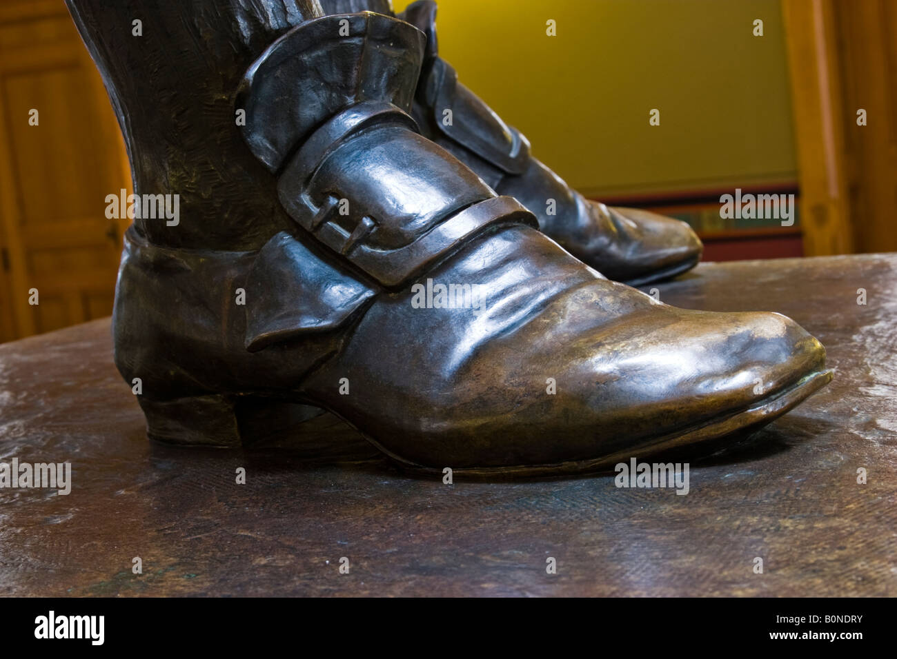 Close up of the feet of a statue Stock Photo - Alamy