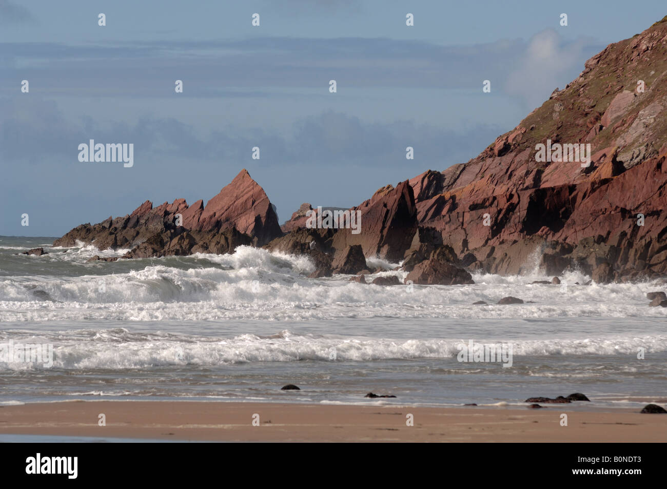 Waves and cliff West Dale beach Dale Pembrokeshire Wales UK Europe ...