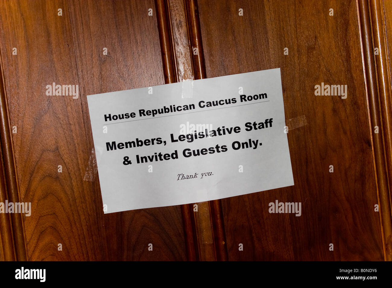 Close up of a sign taped to a wooden office door Stock Photo - Alamy