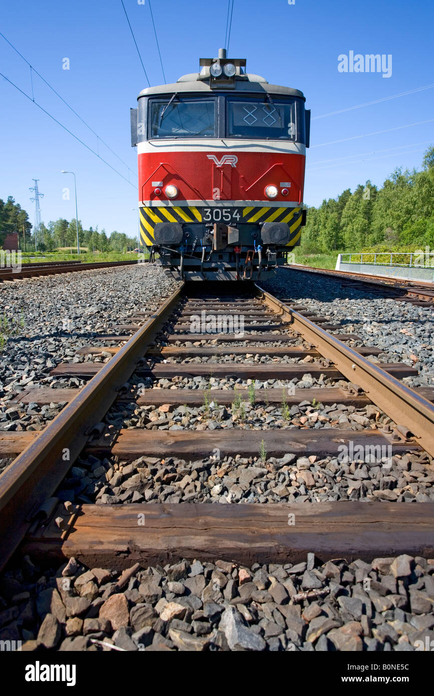 Electric locomotive and wooden sleepers on rails , Finland Stock Photo ...