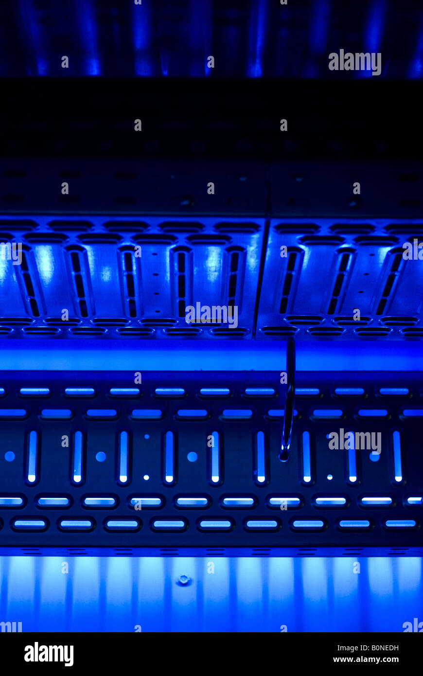Blue light reflecting on metal to create a pattern Stock Photo - Alamy