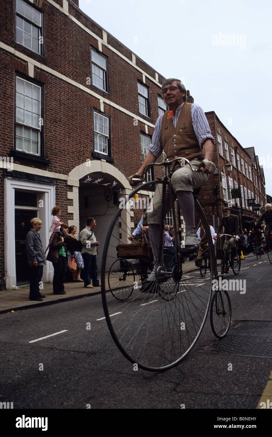 Man riding penny farthing bicycle hi-res stock photography and images ...