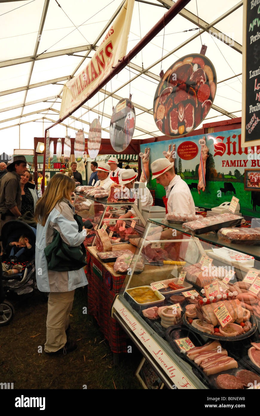 Woman buying meat from a food stall at the Devon County Show, Exeter ...