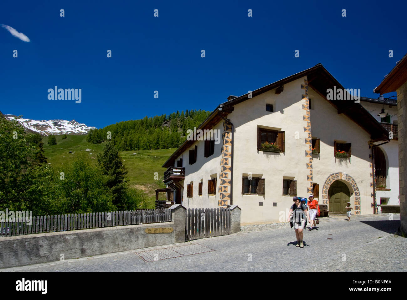 Hikers in the streets of Guarda, Engadin, Switzerland Stock Photo - Alamy