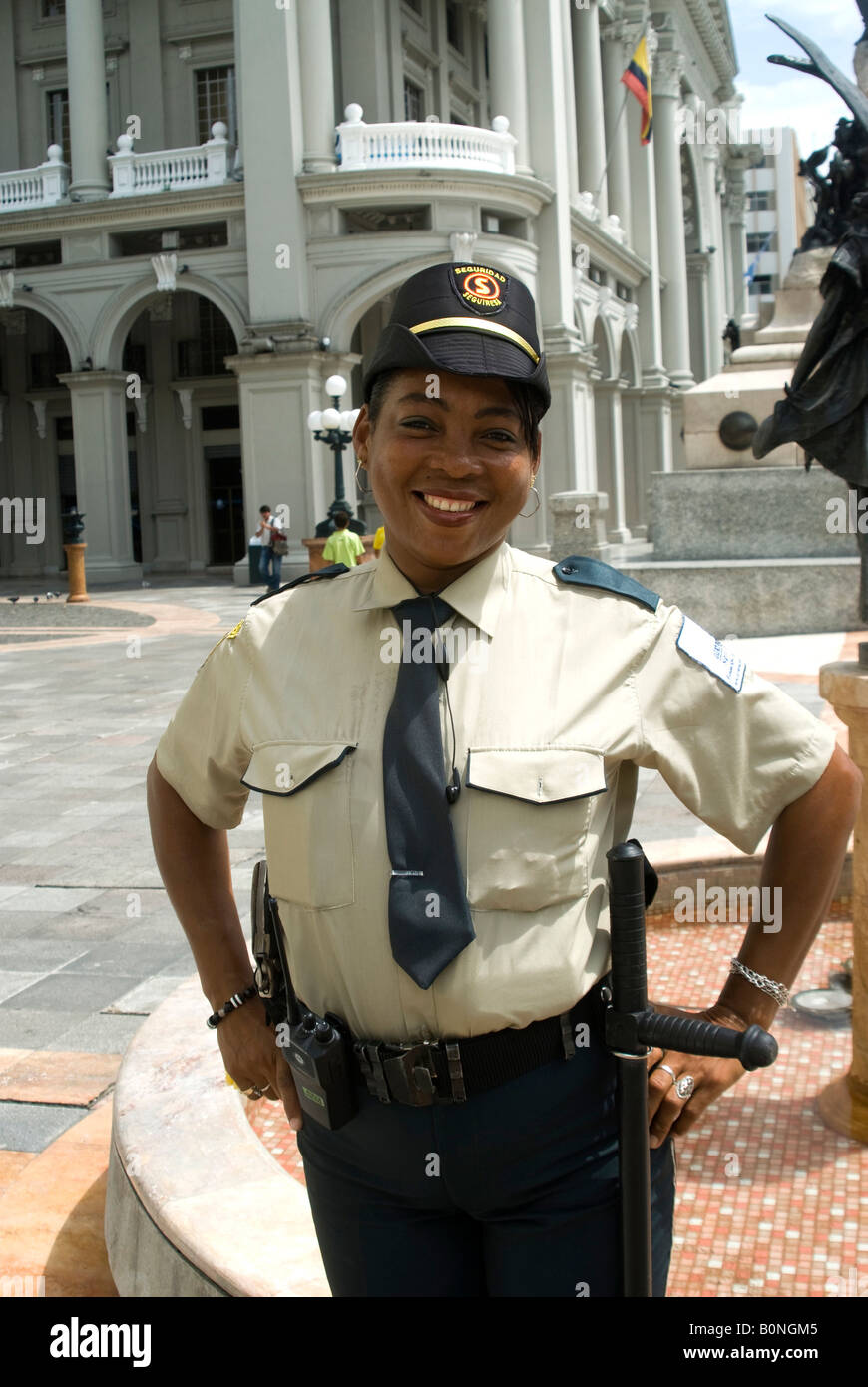 friendly smiling happy police woman in front of government building ...