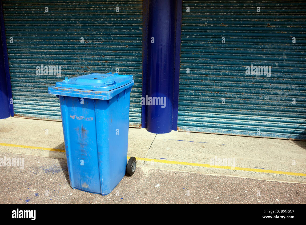 Blue Garbage bin Stock Photo - Alamy