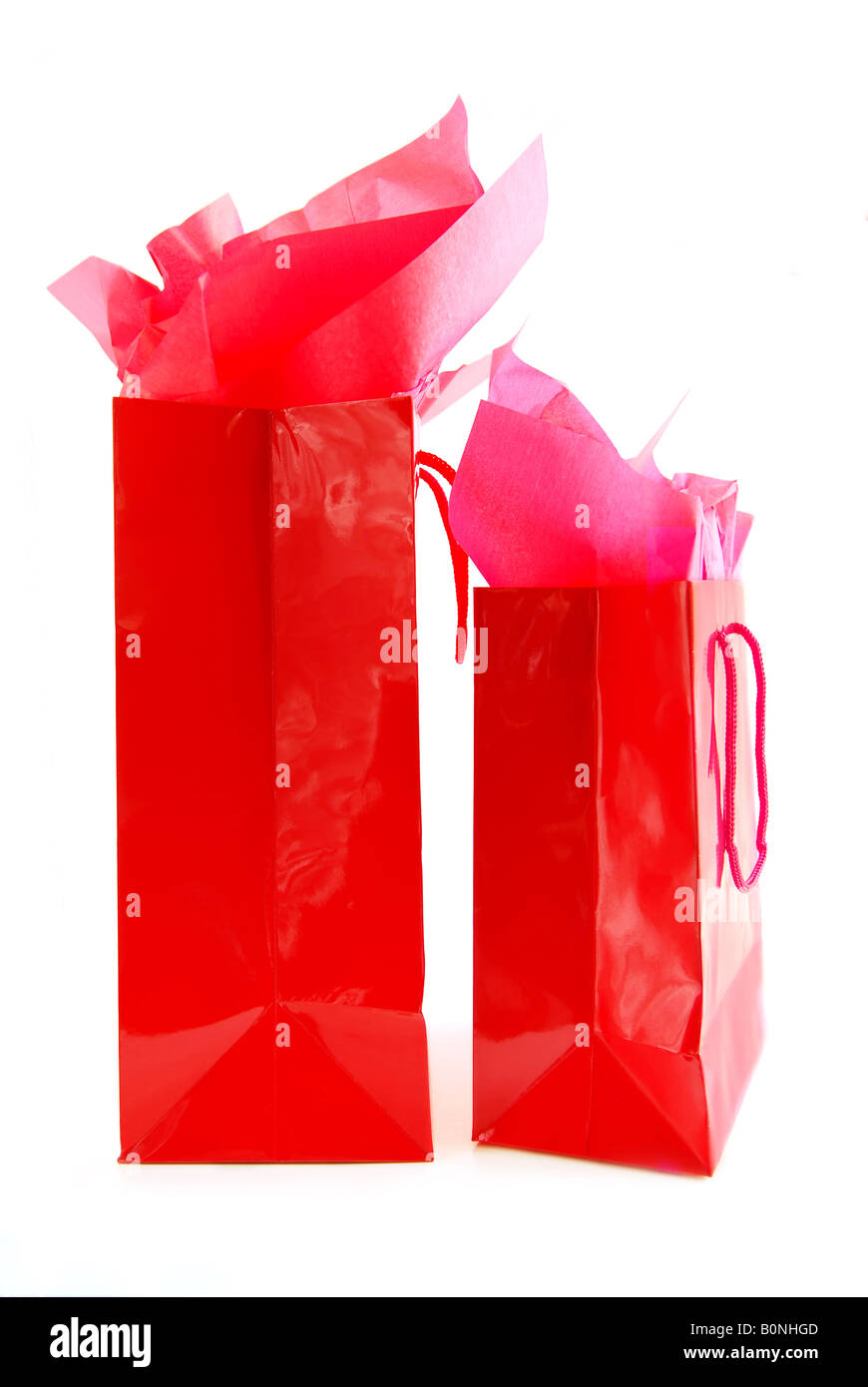Two red shopping bags isolated on white background Stock Photo - Alamy