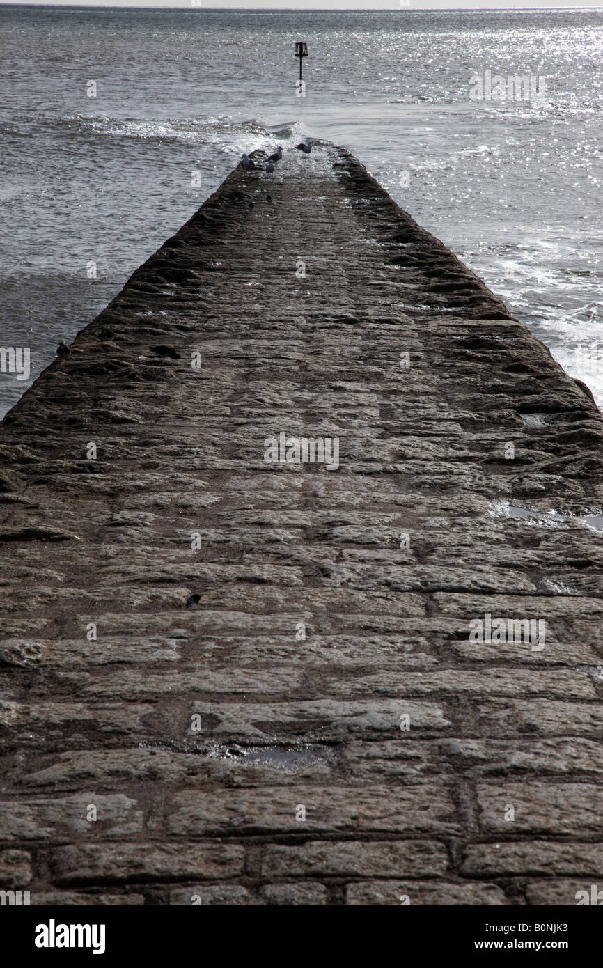 A stone pier forms part of the sea defences at Dawlish South Devon ...