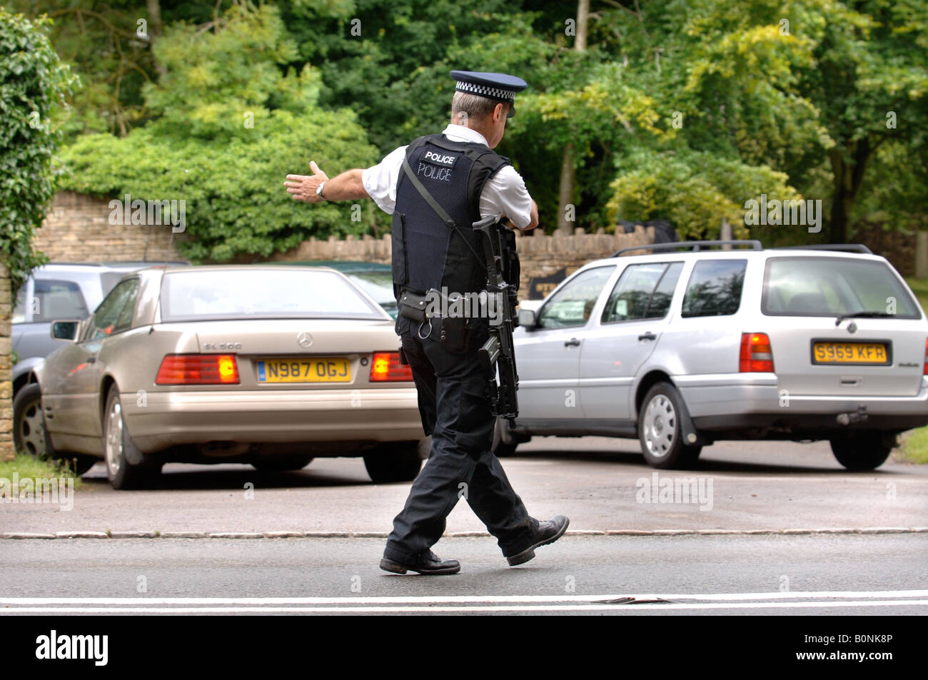 Policeman hand signals hi-res stock photography and images - Alamy