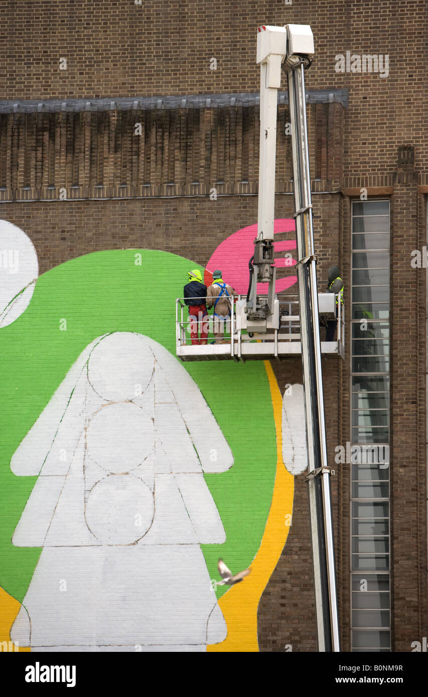 Tate Modern contemporary modern art wall mural being created by men in ...