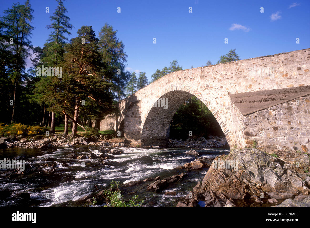 Old Bridge of Dee, an ancient military crossing over the fast flowing ...