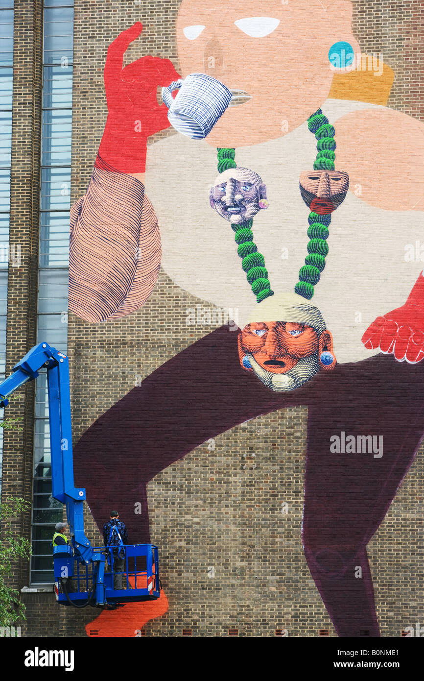 Tate Modern contemporary modern art wall mural being created by men in ...