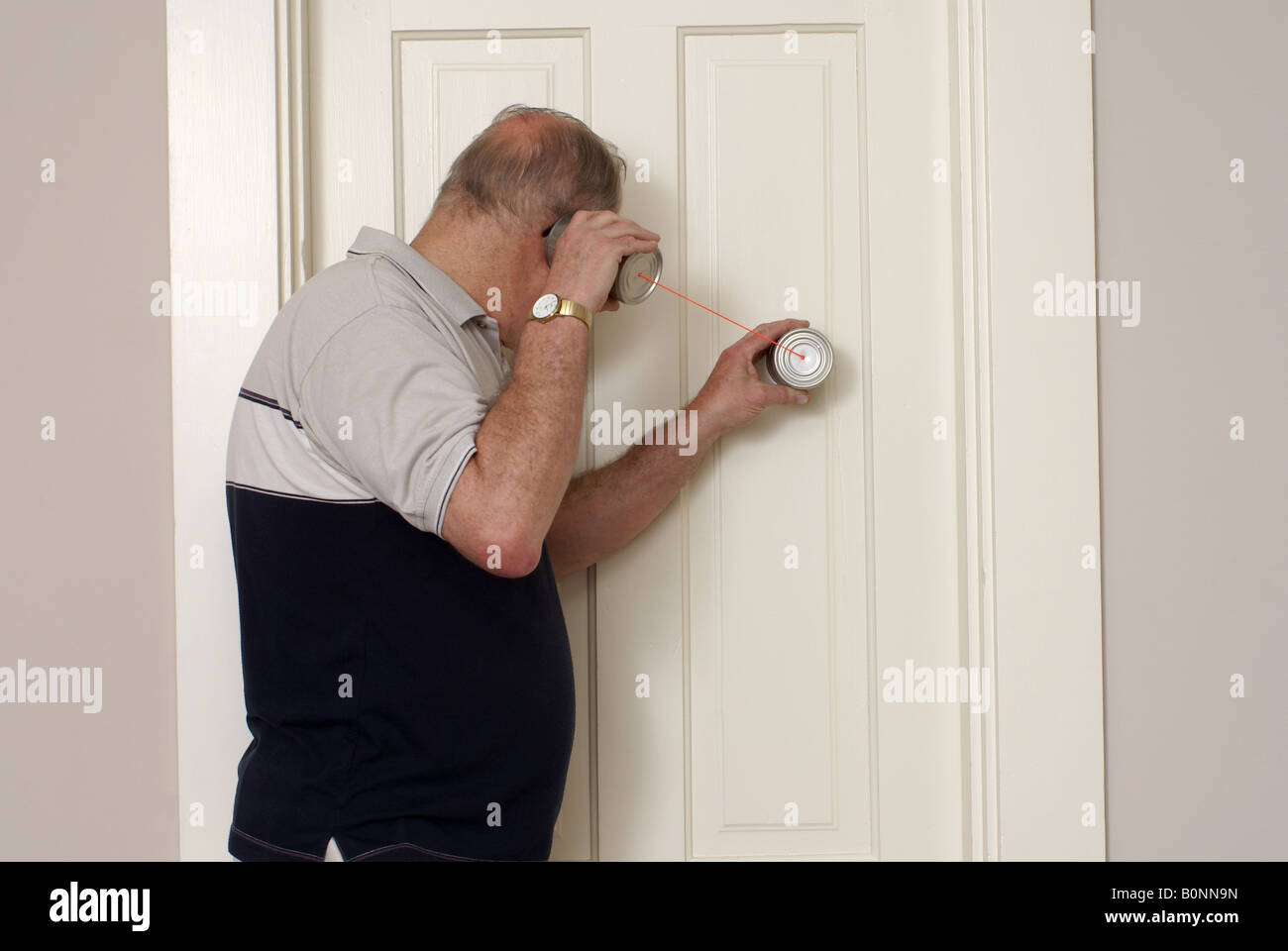 Eavesdropping at door hi-res stock photography and images - Alamy