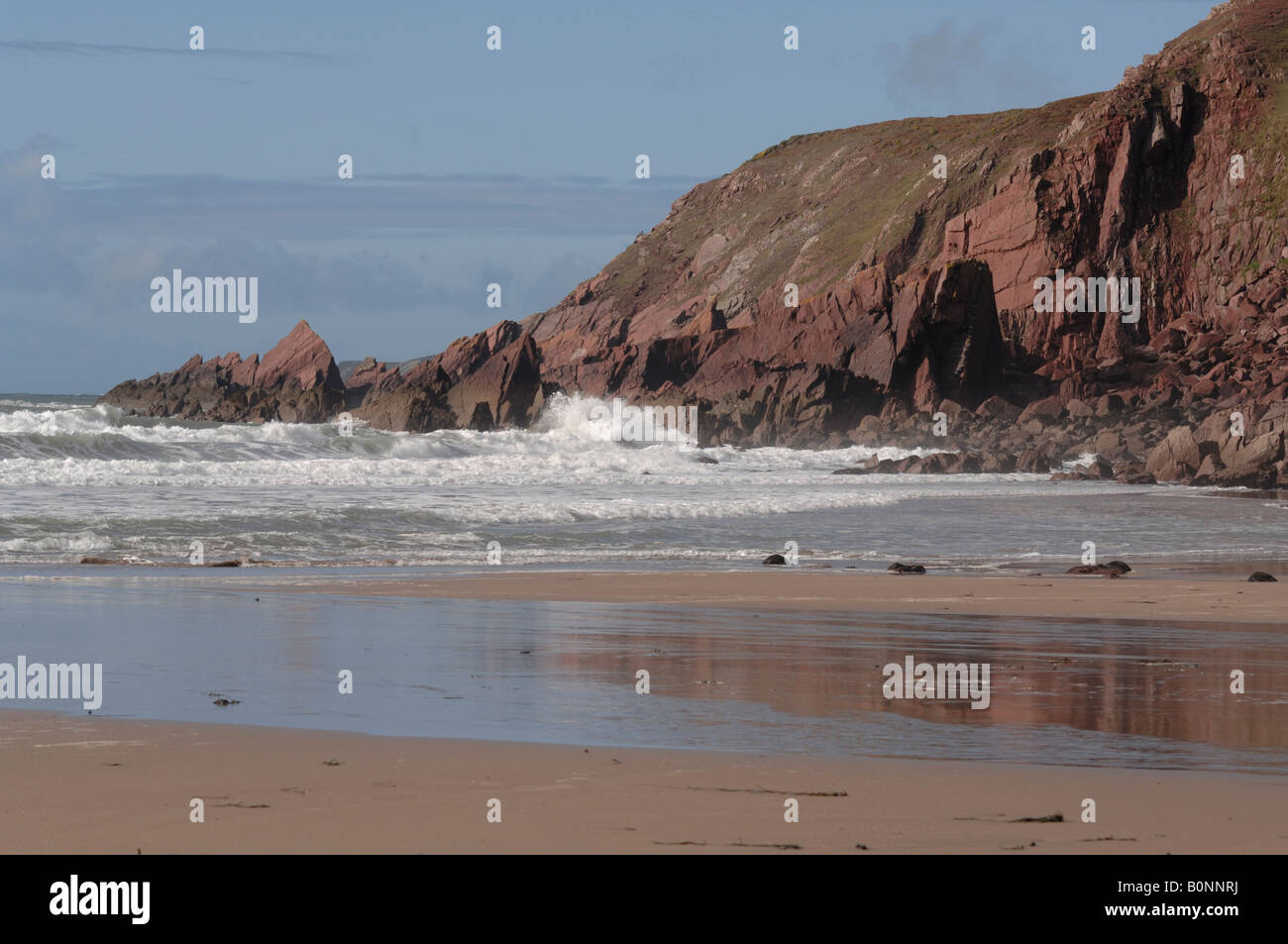 Waves and cliff West Dale beach Dale Pembrokeshire Wales UK Europe ...