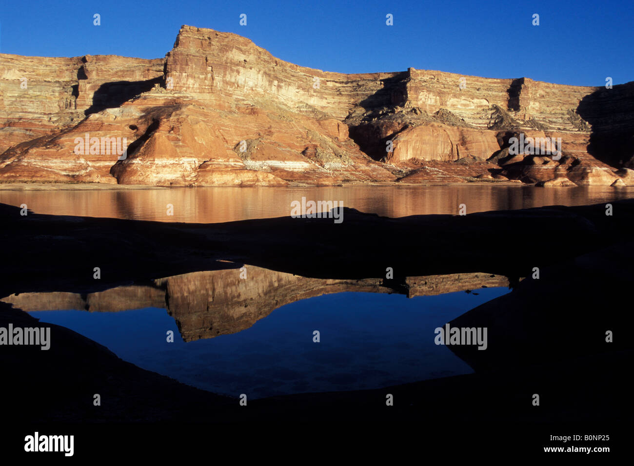 Canyon walls reflect in weathering pit near Cookie Jar Butte, Lake ...