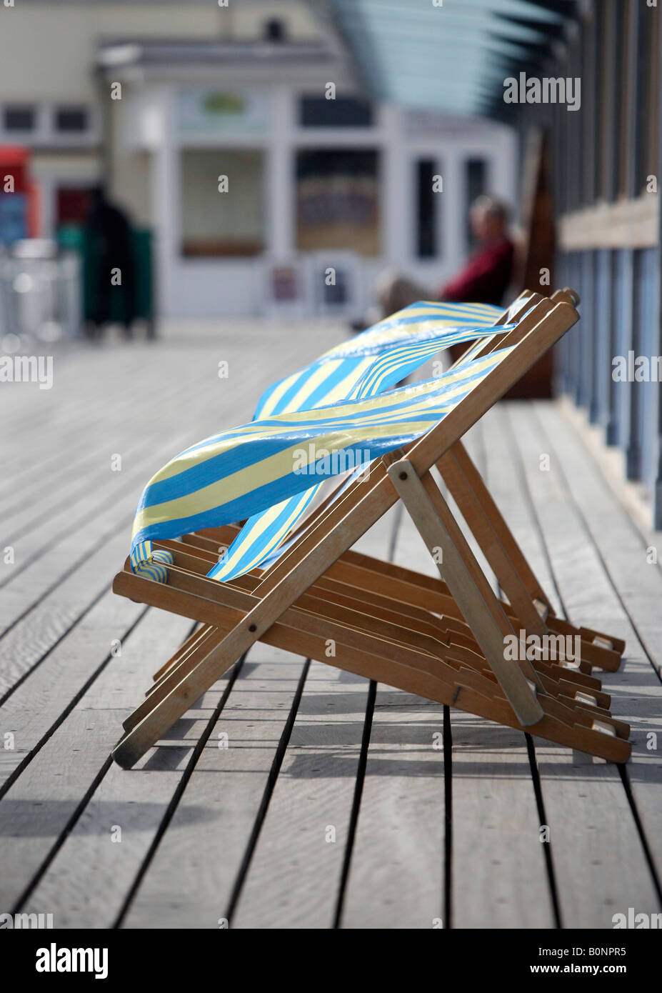 Deckchairs being blown around in the wind Stock Photo - Alamy