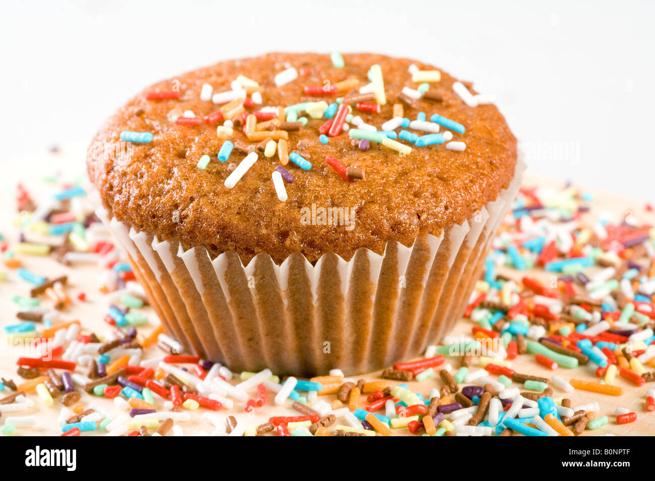 tasty muffin with colorful sprinkles isolated Stock Photo - Alamy