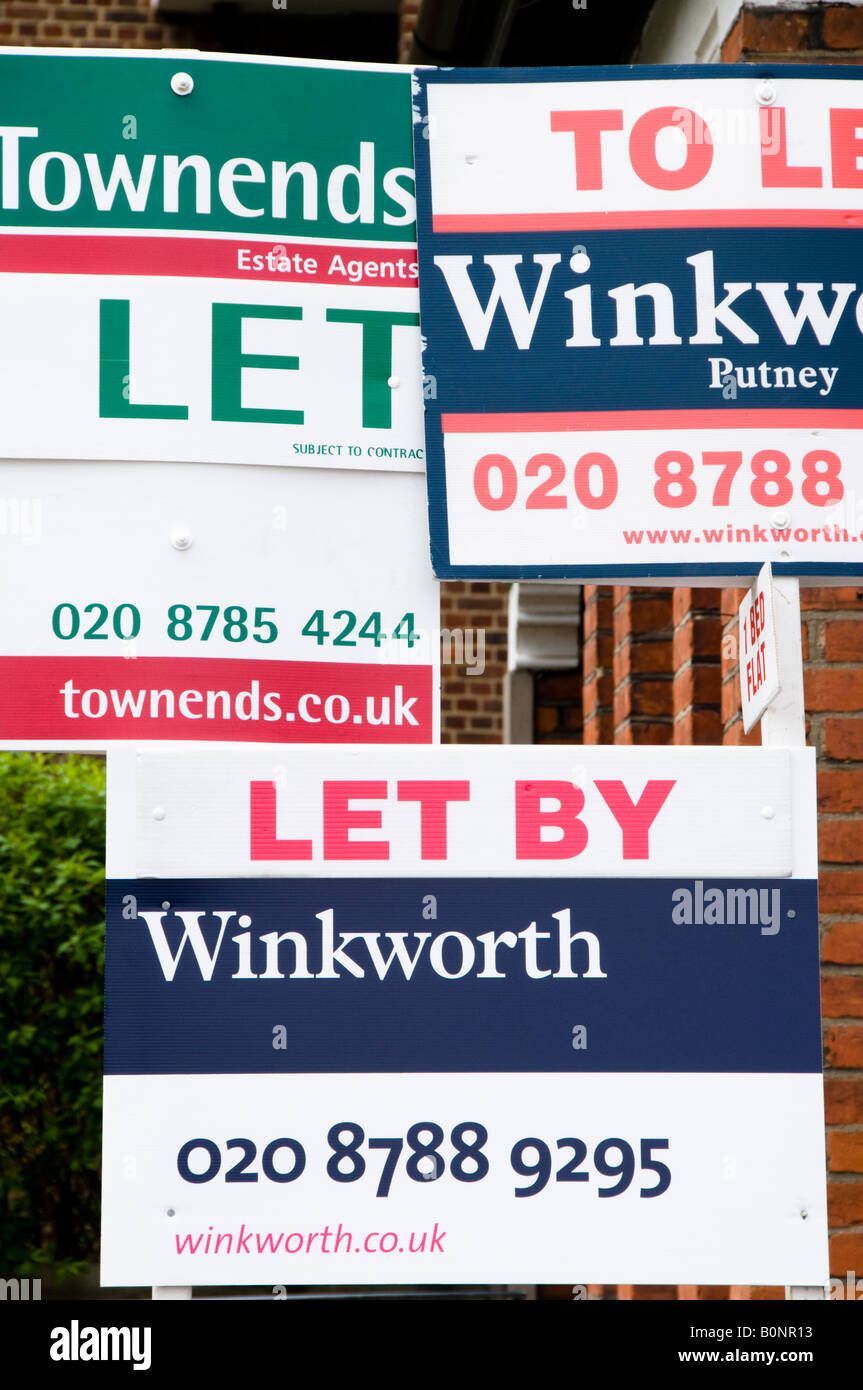 To Let Signs of various Estate Agents Stock Photo - Alamy
