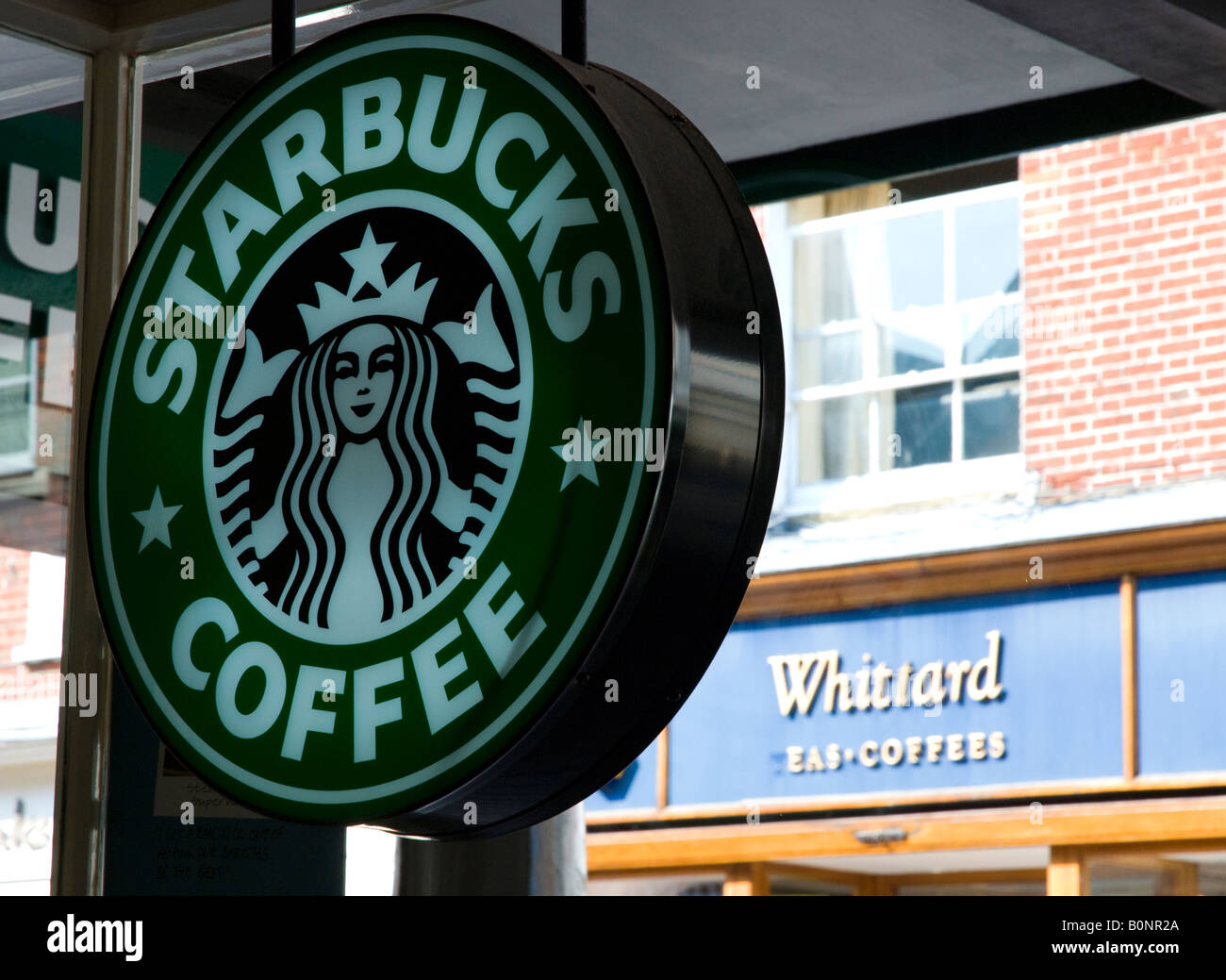 Starbucks sign against a background of a Whittard Tea shop window Stock ...