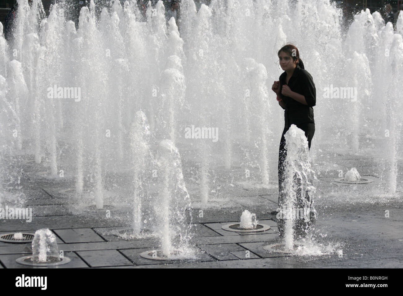 "Young Female getting wet in The Piccadilly Fountain, Manchester UK ...