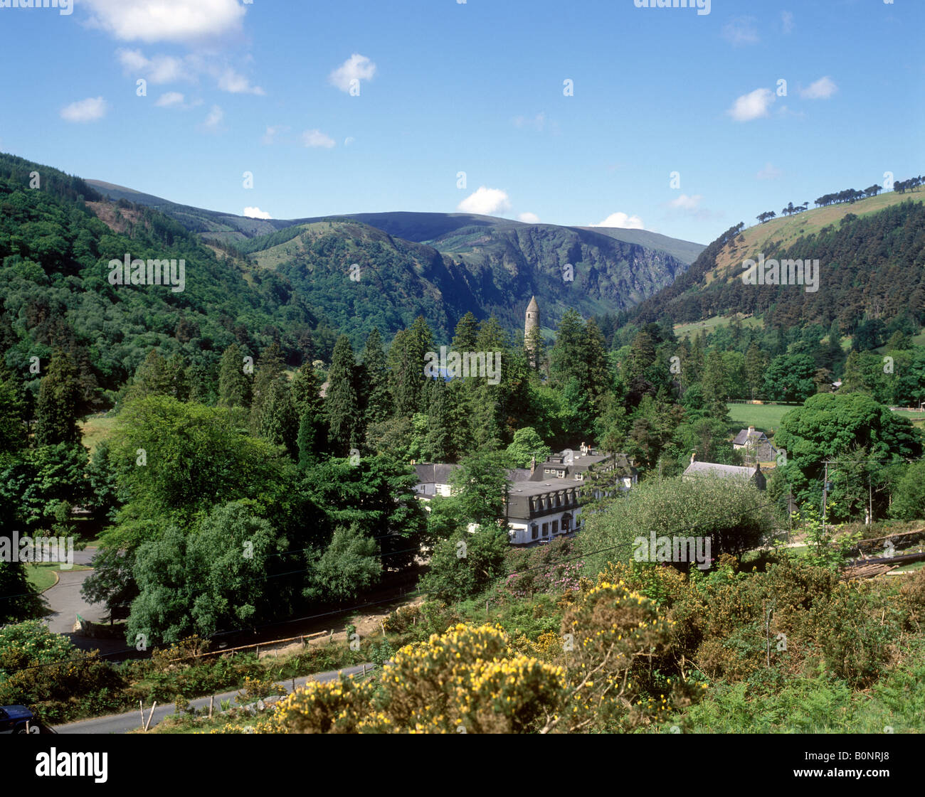 Glendalough - Round Tower set in the Valley of the Two Lakes, one of ...