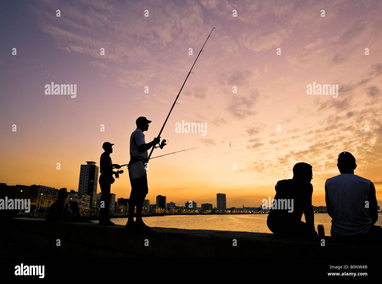 Cuban men fish at the seaside. Malecon. Havana. Cuba Stock Photo - Alamy