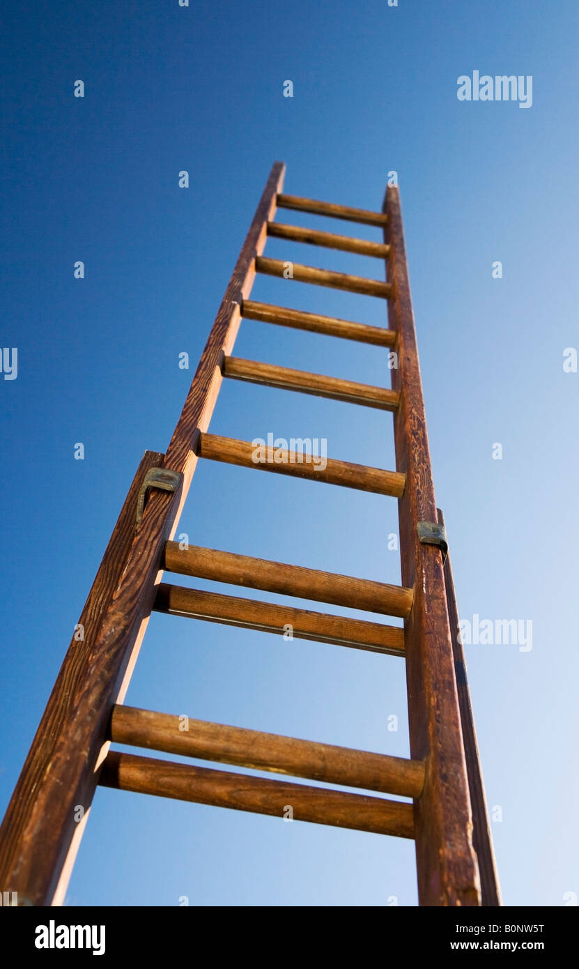 A two-piece vintage wooden ladder with a blue sky background Stock ...