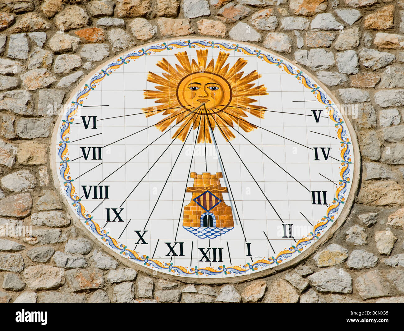 Ceramic sundial on the stone wall Stock Photo - Alamy