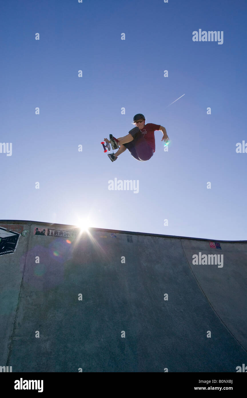 Teenage girl performs a jump in a skateboard park Stock Photo - Alamy