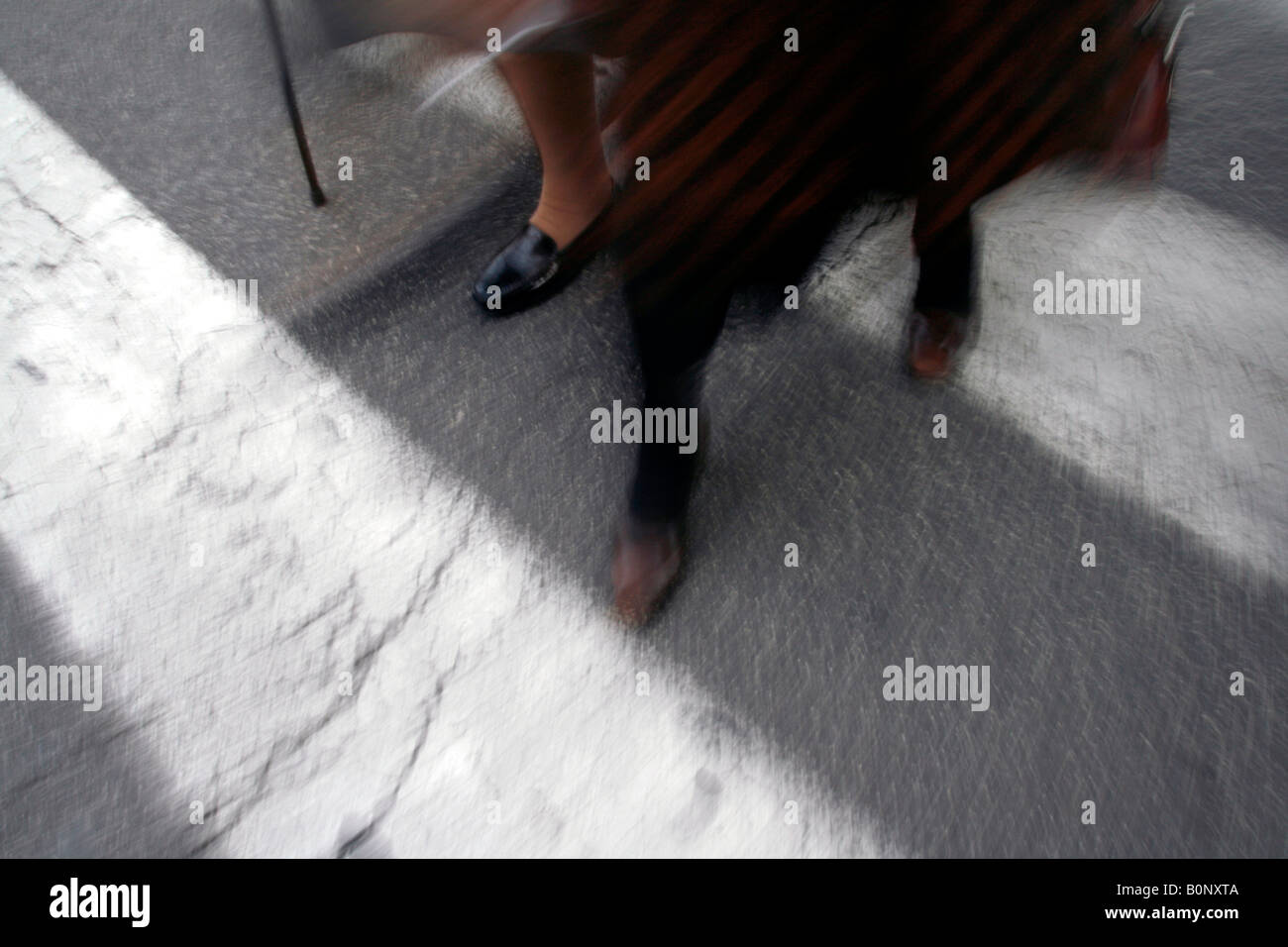 one person walking in street in city town Stock Photo - Alamy