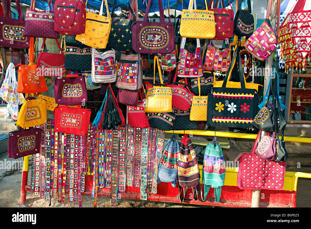 Street stalls displaying ladies handbags, purses, Hampi, Karnataka ...