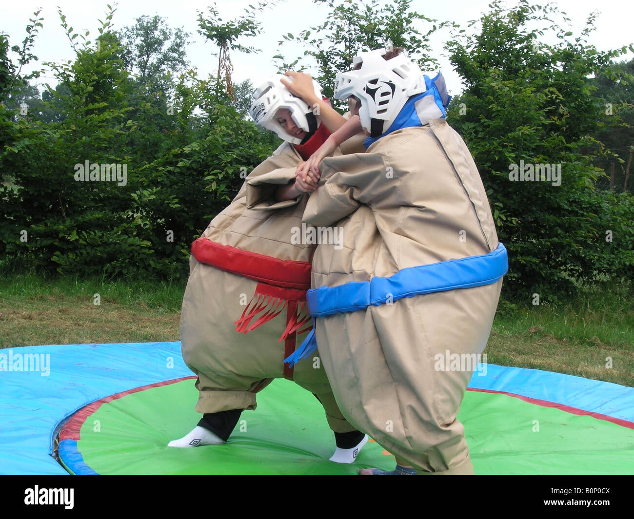 teenage student sumo wrestling at school camp Stock Photo - Alamy